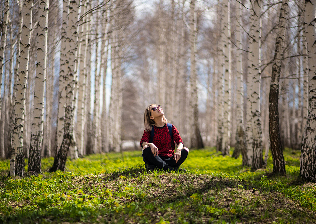 woman-sitting-under-trees-1068x760 - Catechist's Journey